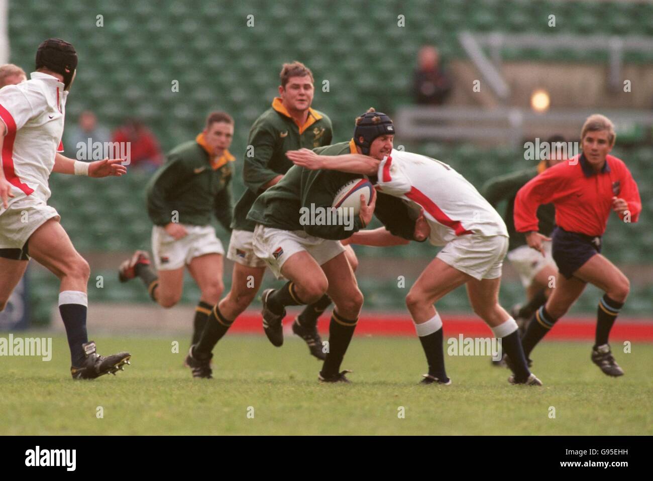 England's Steve Hanley (right) tackles South Africa's Chris Le Roux ...