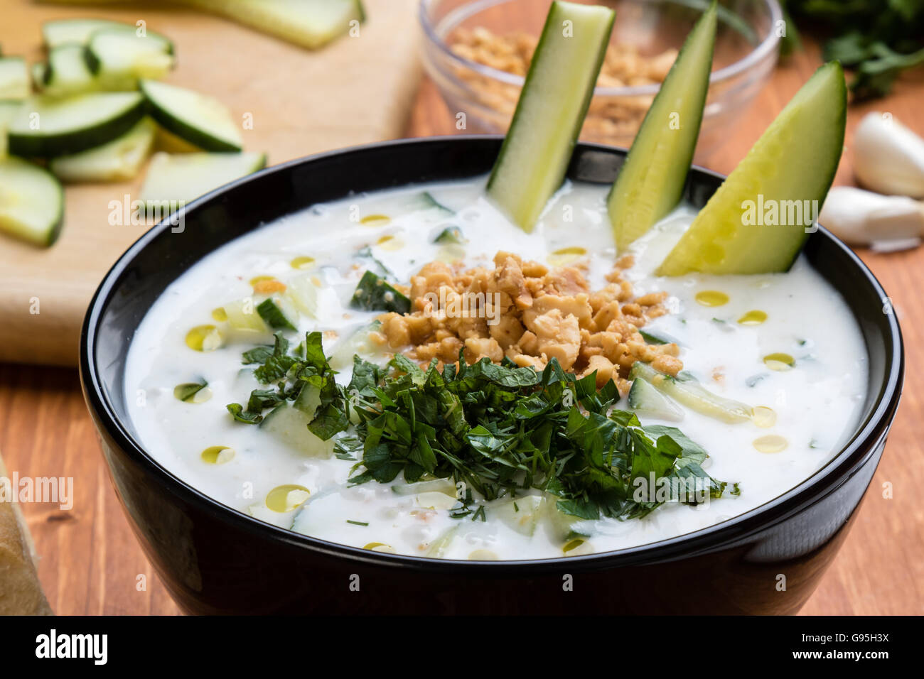 cold fresh tarator soup with nuts in black bowl Stock Photo - Alamy