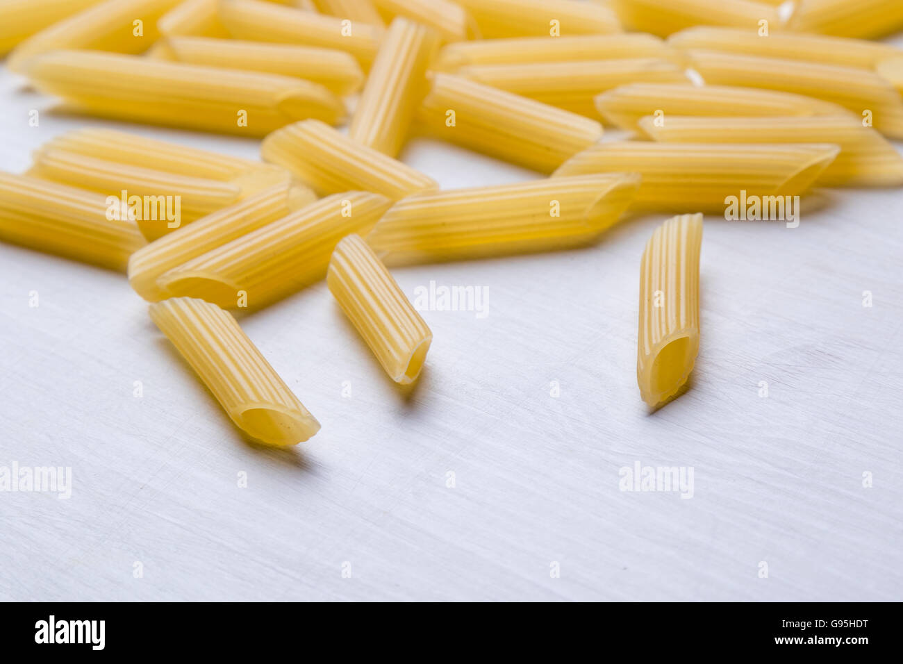 Uncooked penne pasta hi-res stock photography and images - Alamy