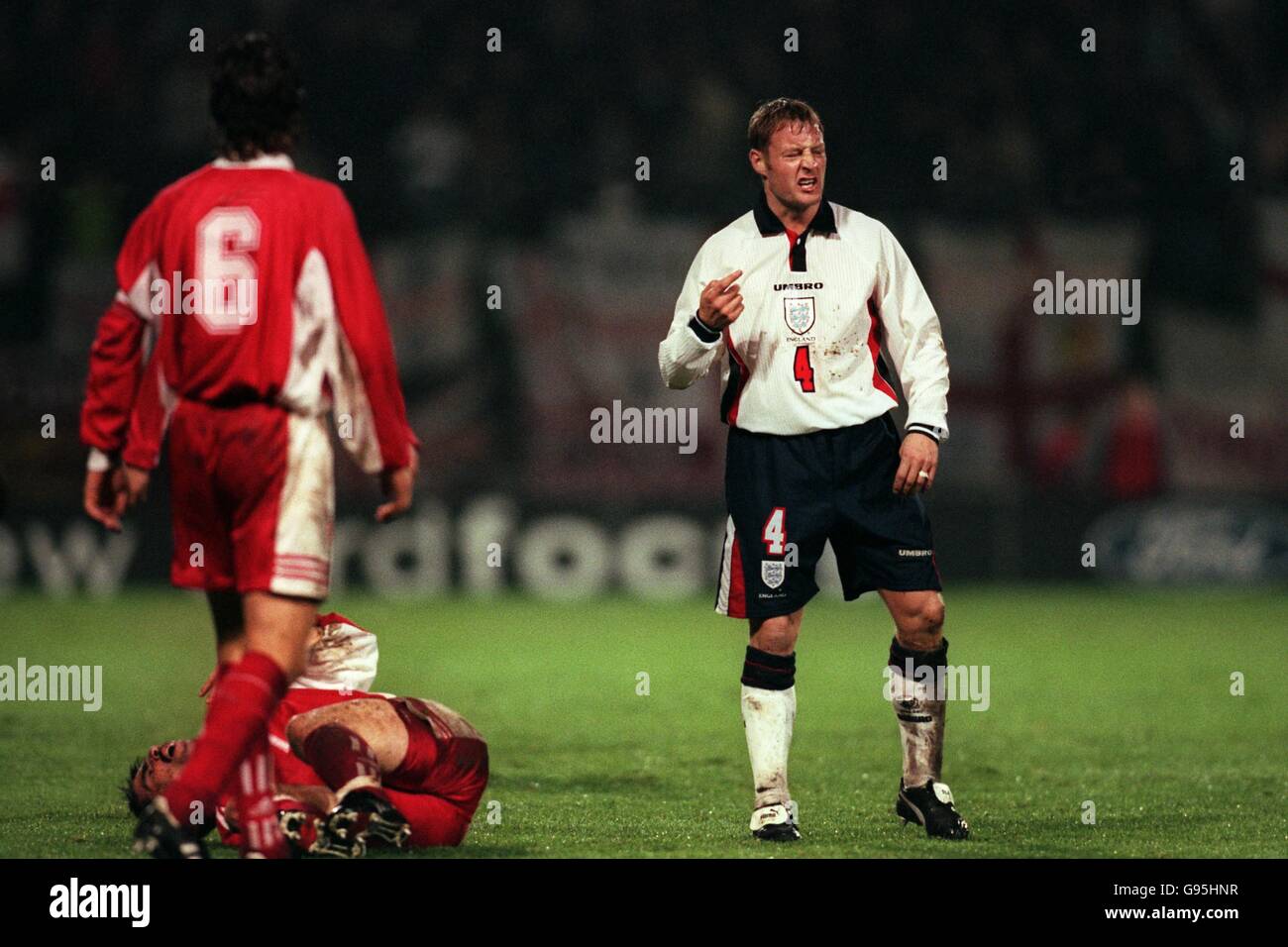 England's David Batty (right) shows his displeasure as the referee ...