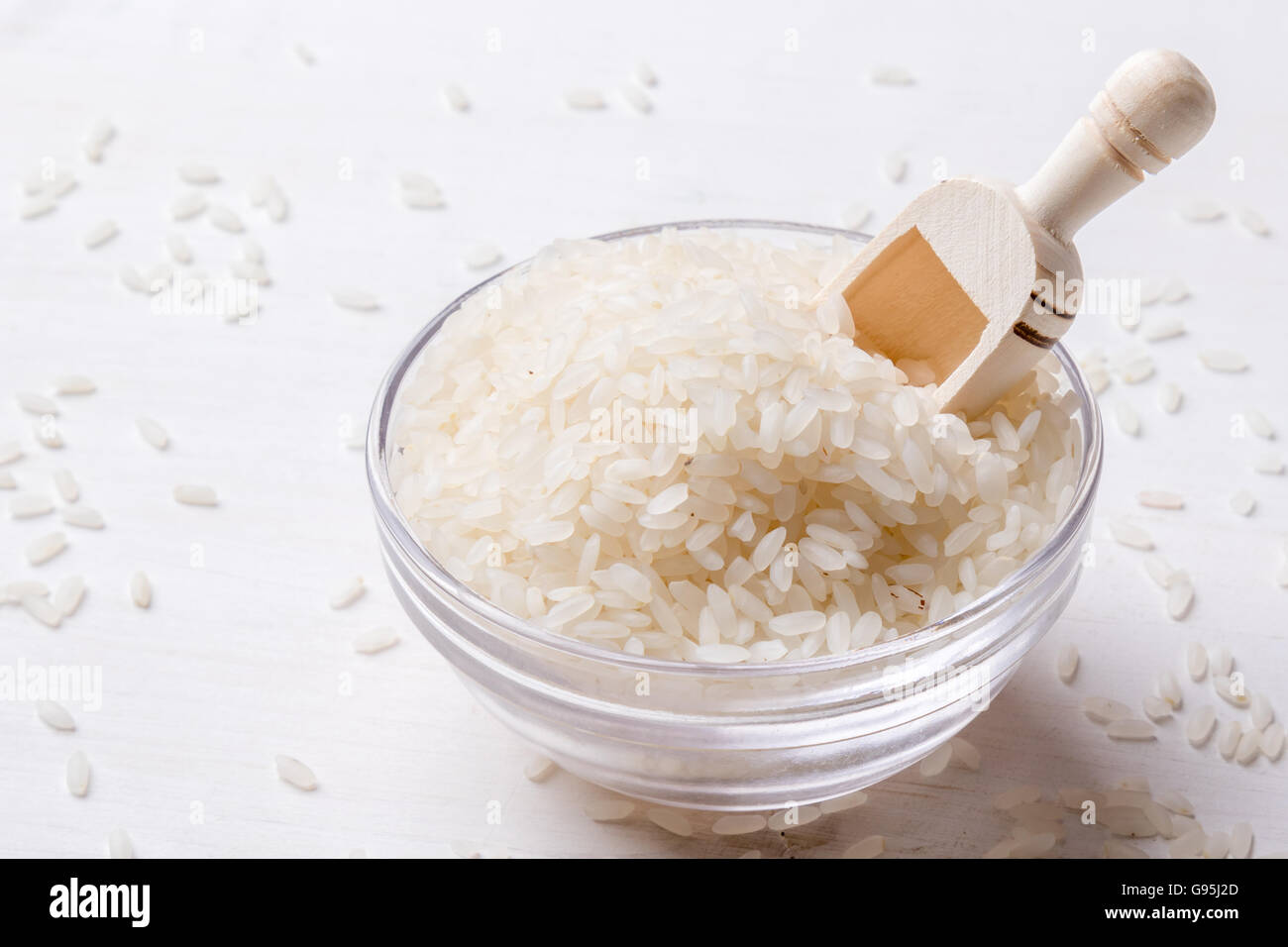 white rice in a glass jar on table Stock Photo - Alamy