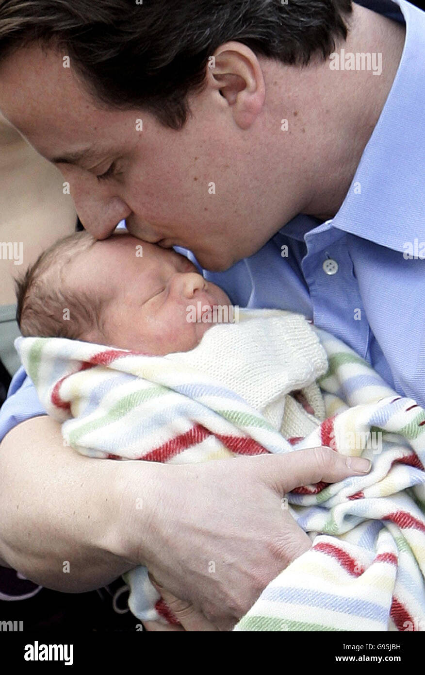 Conservative party leader David Cameron kisses his new son, Arthur ...