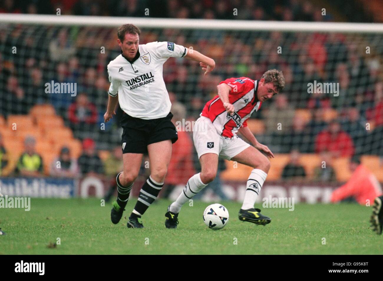 Port Vale's Peter Beadle (left) puts Sheffield United's Steve Bruce ...