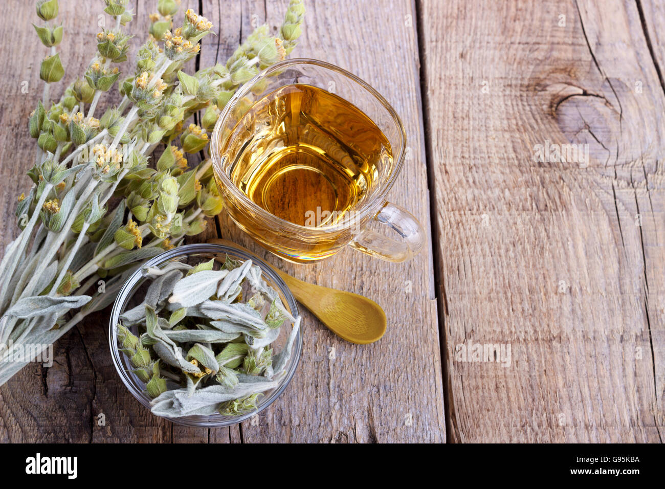 Mountain tea. Sideritis herbal tea and flowers on wooden background ...
