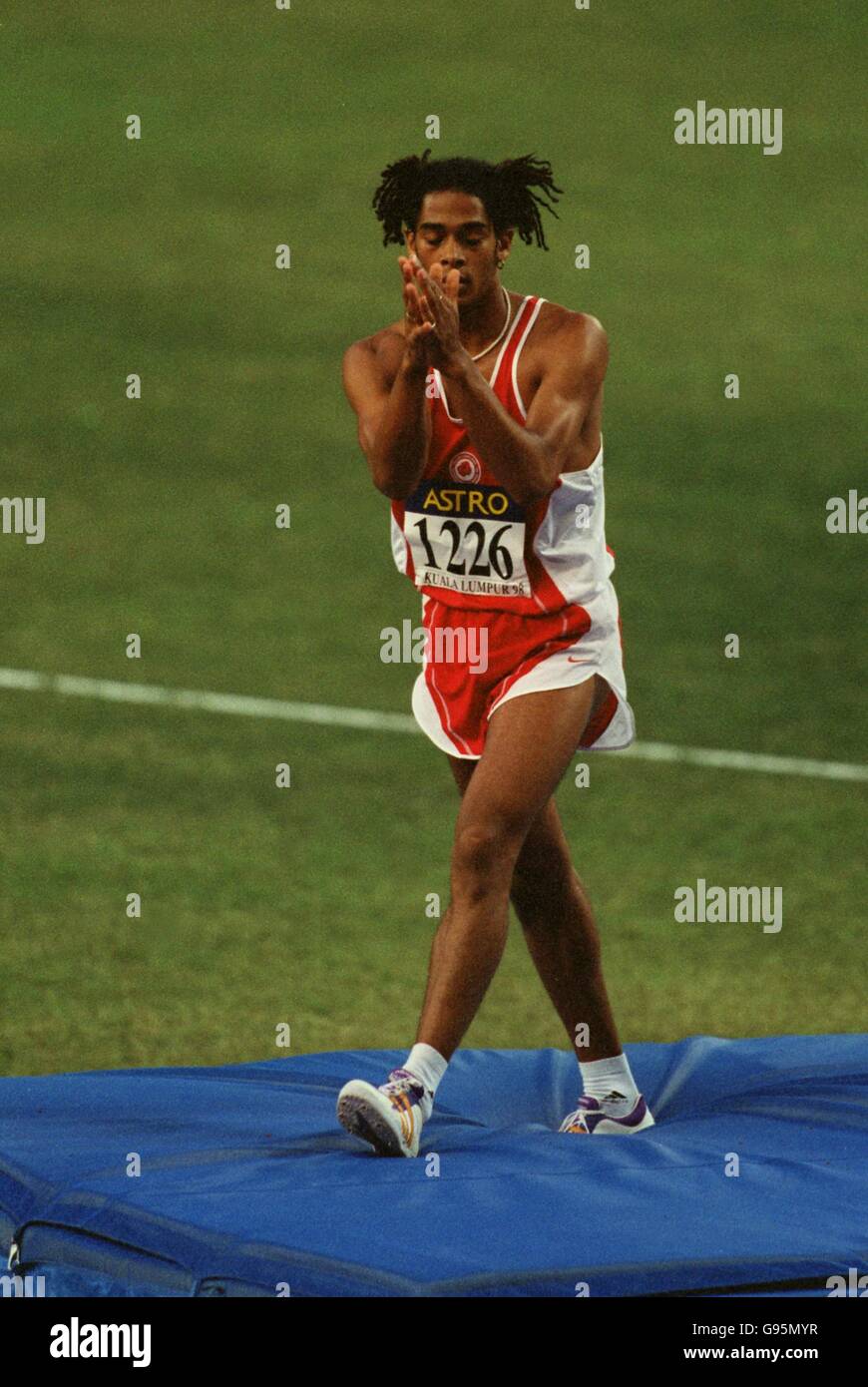Silver medallist Benjamin Challenger of England holds his head after ...