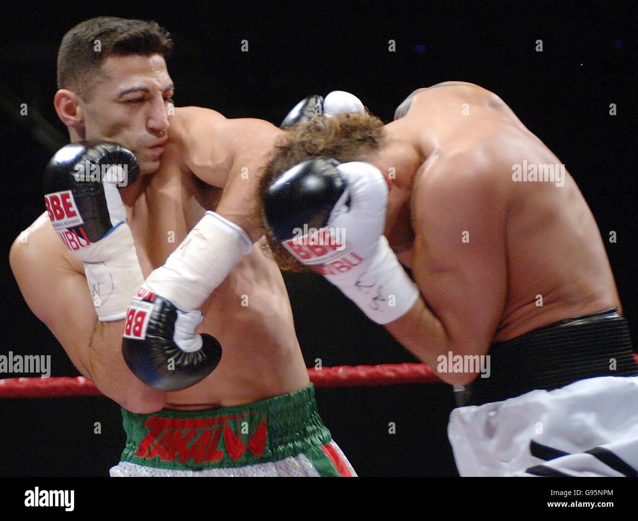 England's Mehrdud Takaloo (L) in action against Germany's Turgay Uzun ...