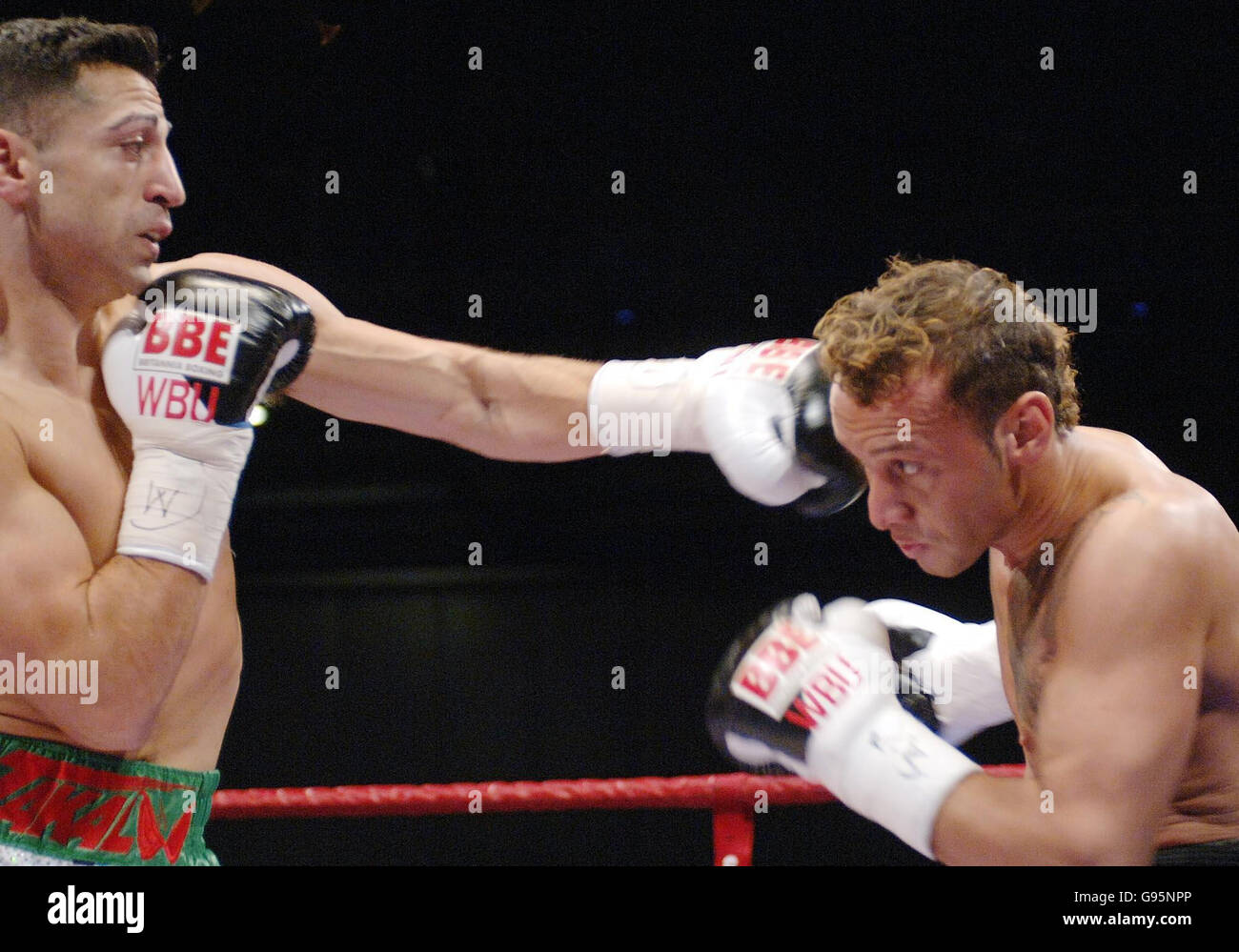 England's Mehrdud Takaloo (L) in action against Germany's Turgay Uzun ...