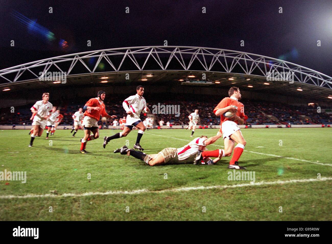 Holland's Rick Lips (right) tries to escape an England tackle Stock ...