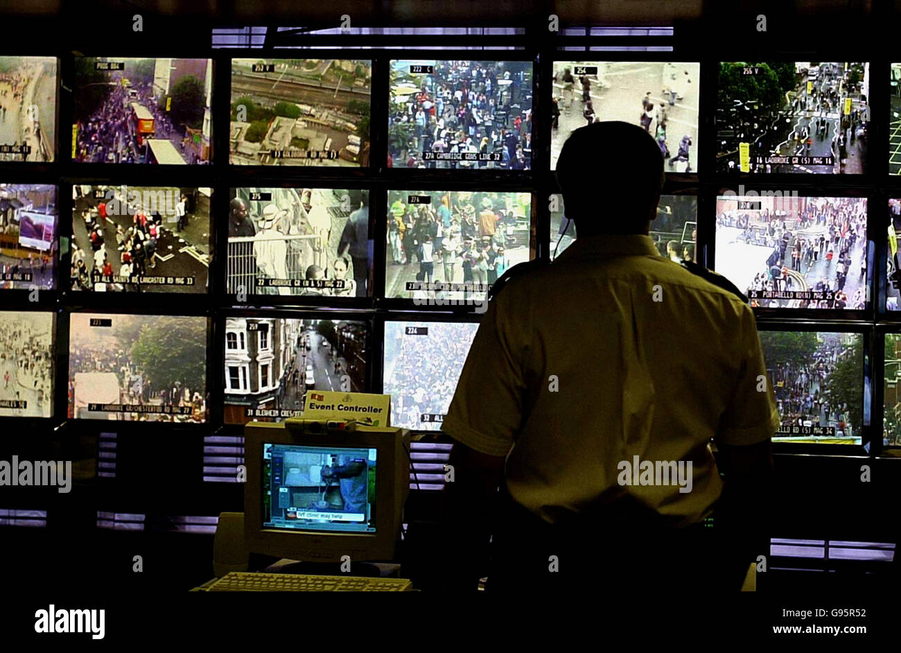 A police officer looks at a bank of screens showing the Notting Hill ...