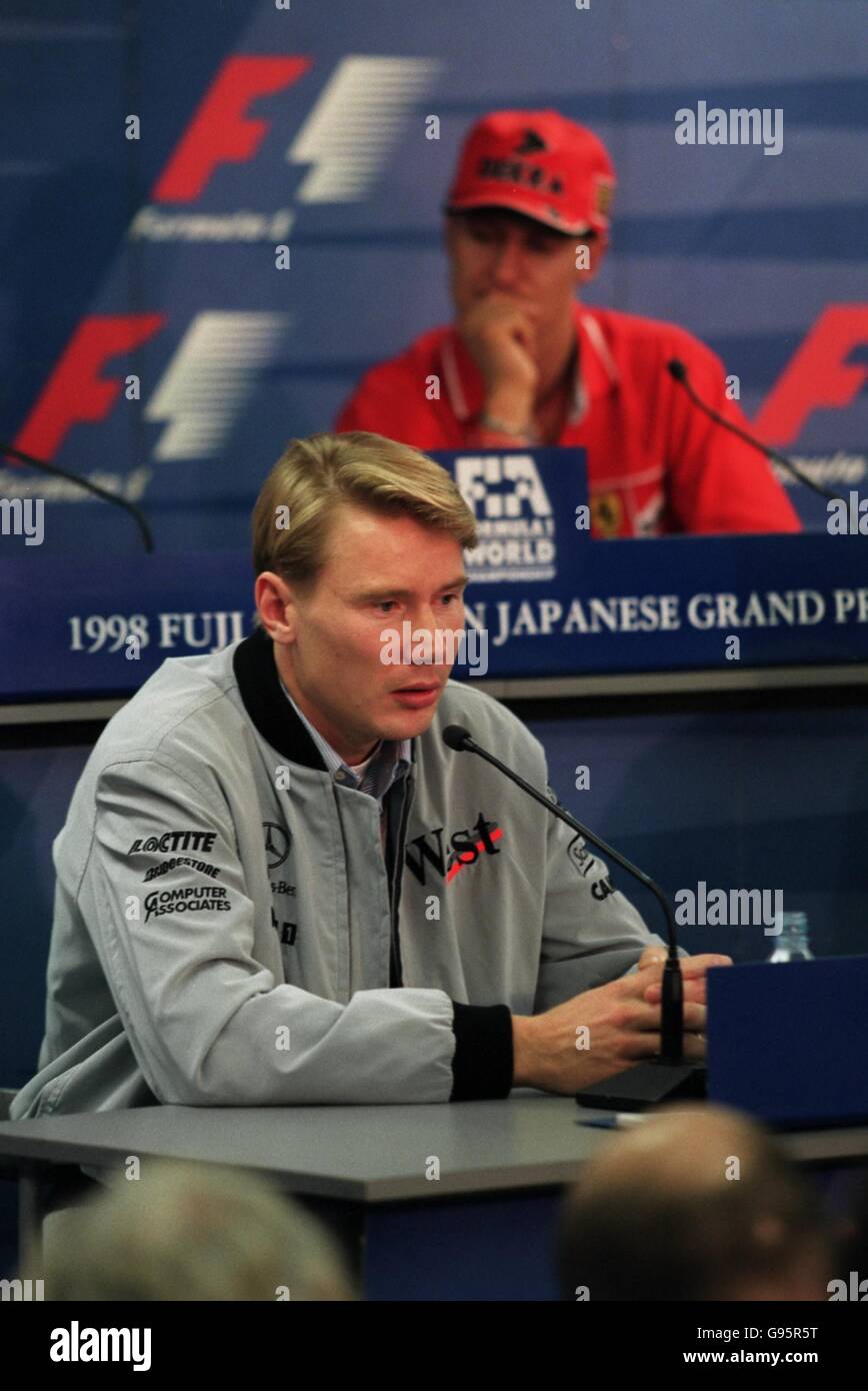 Formula One Motor Racing - Japanese Grand Prix - Thursday Practice. Mika Hakkinen sits in front ...