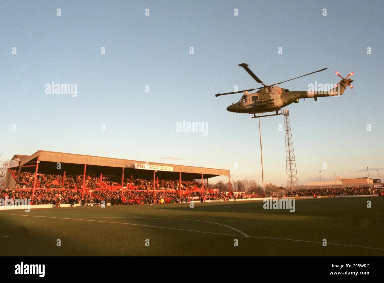 An army helicopter lands in the Doncaster Rovers Belle Vue ground to ...