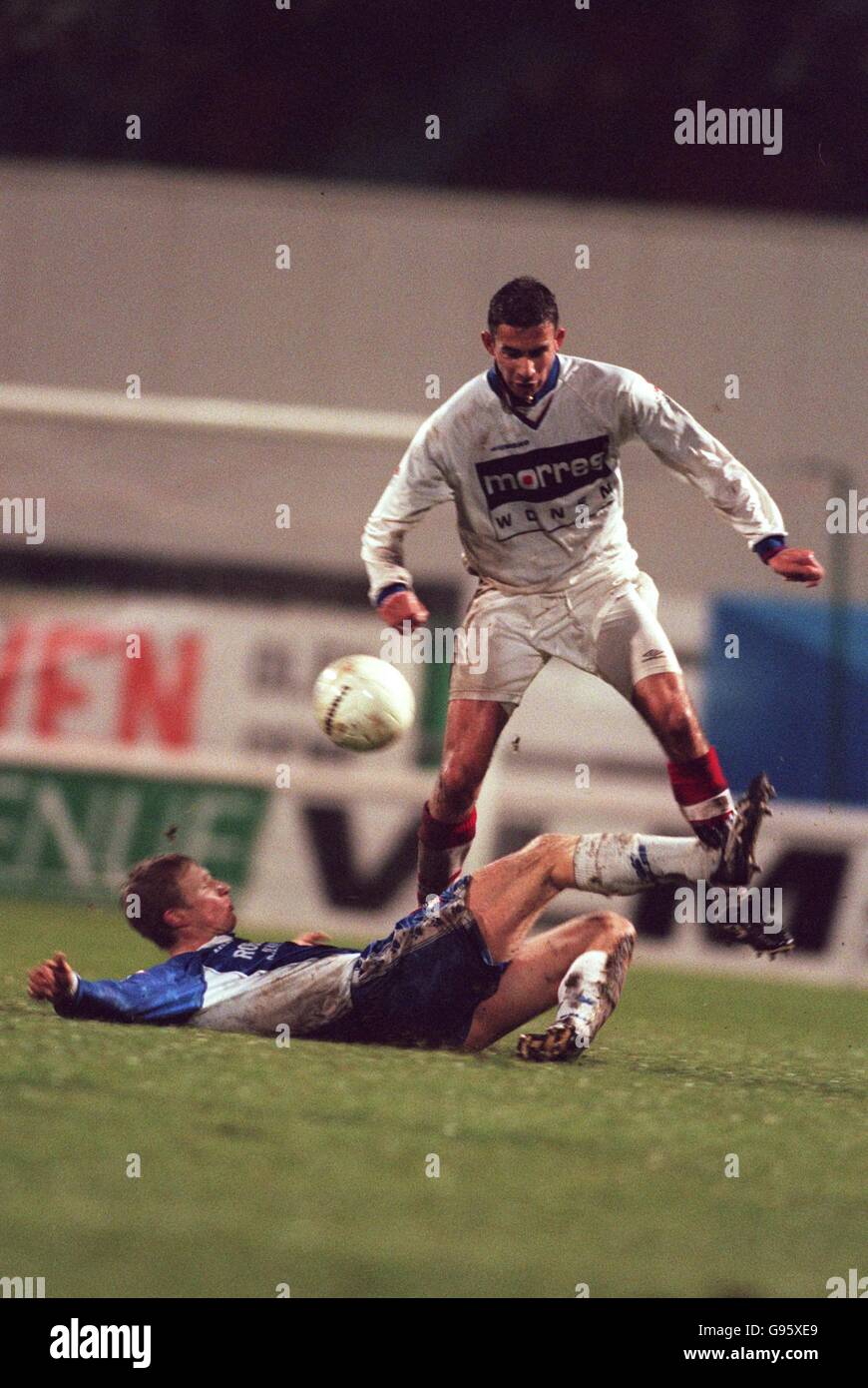 Manchester United's Danny Higginbotham, gets past Glen Dillens of FC ...