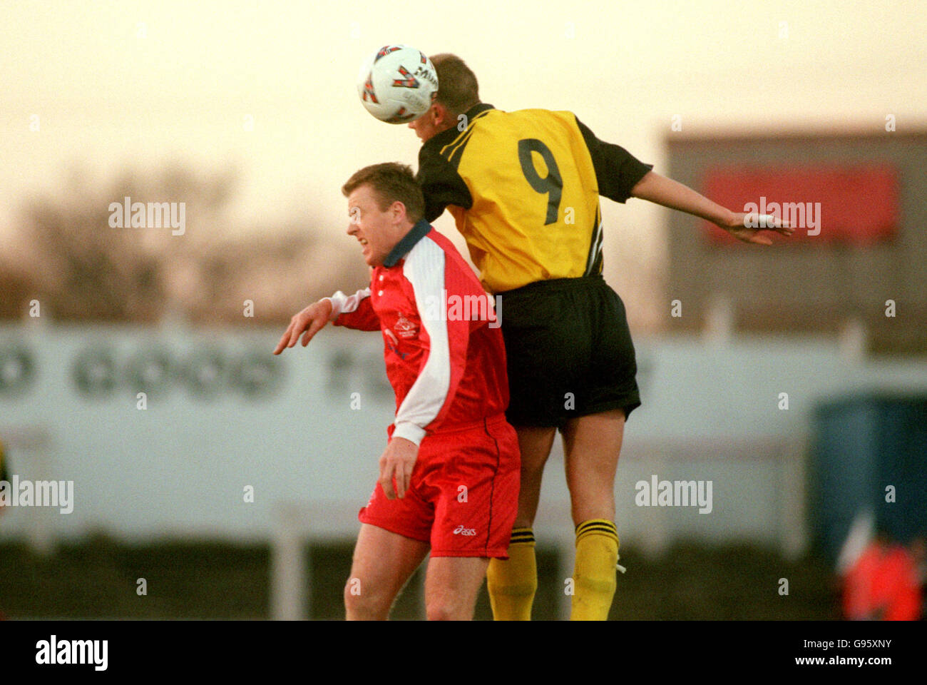Rushden and Diamonds' Colin West (right) climbs above Doncaster Rovers ...