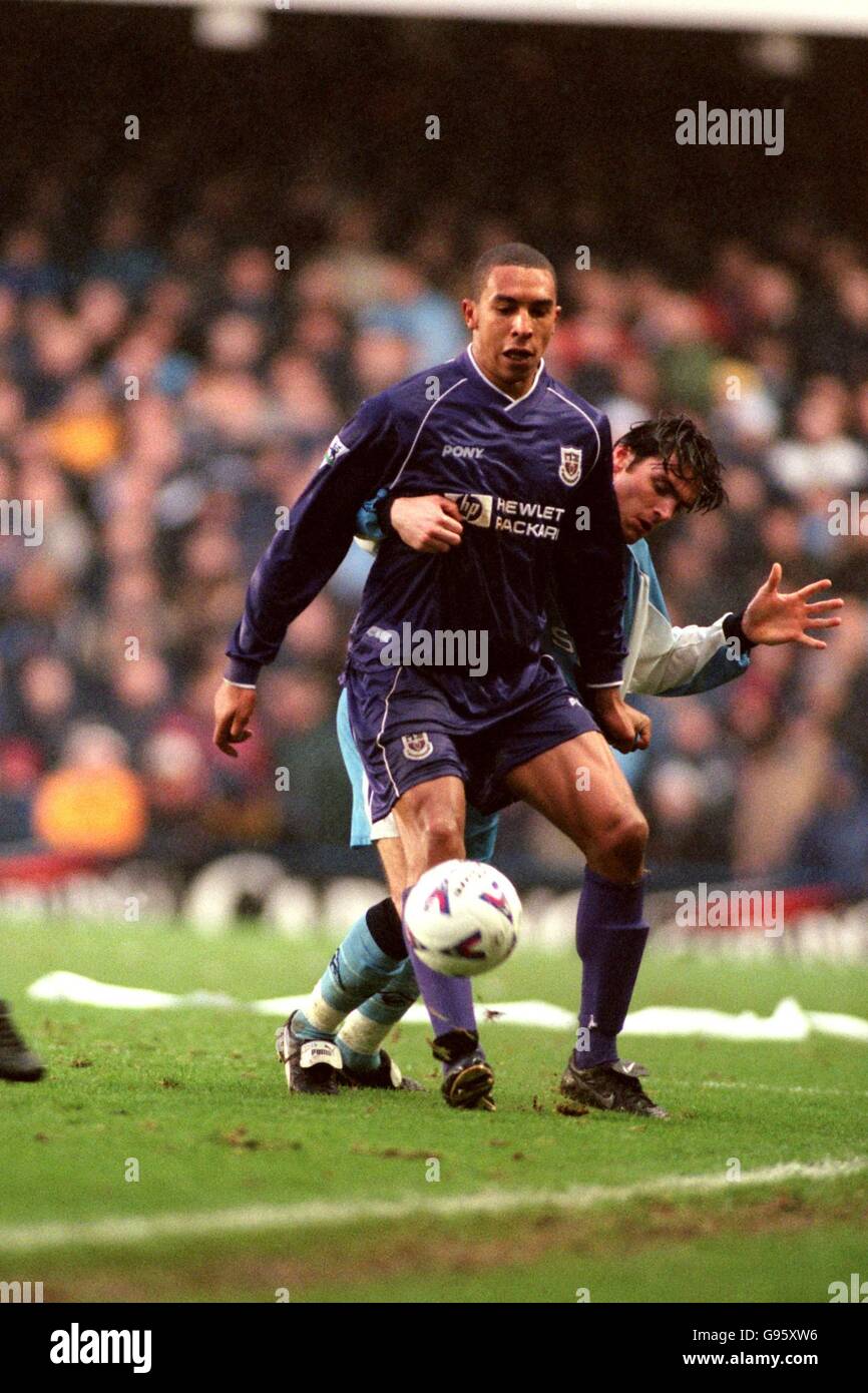 Tottenham Hotspur Chris Armstrong holds off Coventry's Marc Edworthy ...