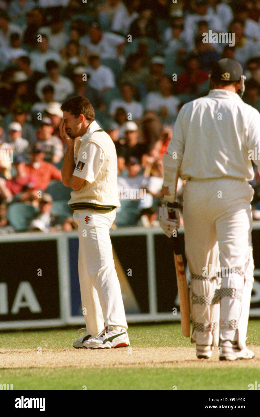 Australia's Damian Fleming holds his head in his hands after having an ...