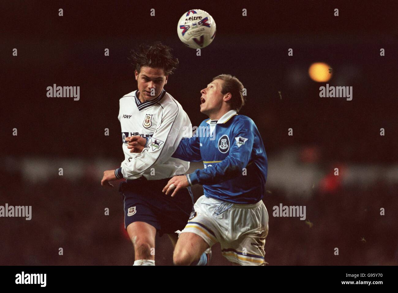 Tottenham hotspurs luke young evertons nick battle for high ball hi-res ...