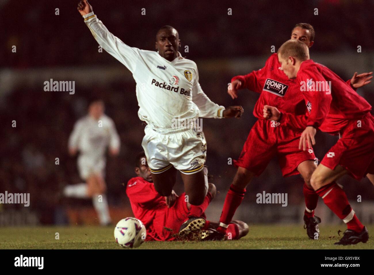 Leeds United's Jimmy Floyd Hasselbaink is upended by Wimbledon's Robbie ...