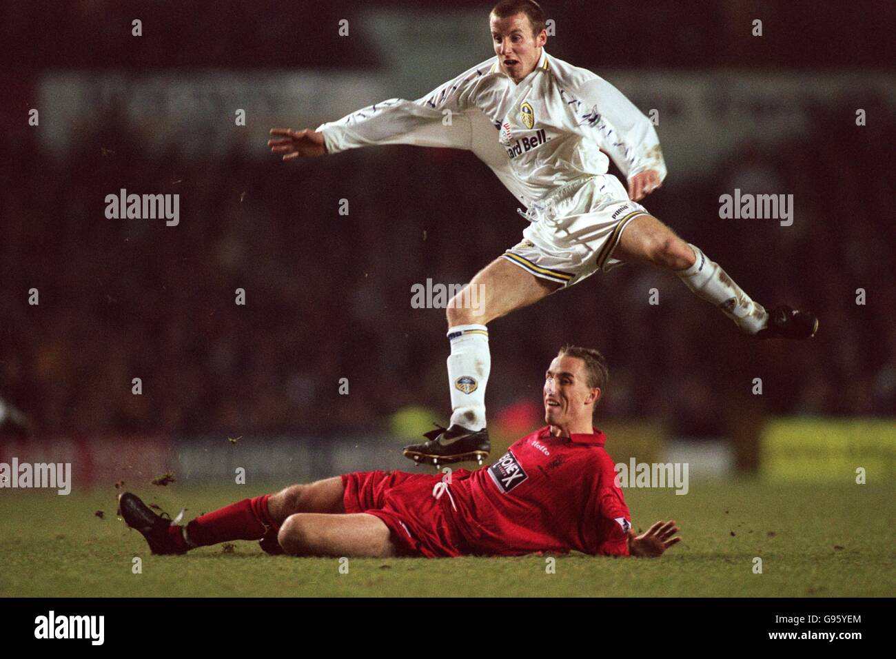 Wimbledon's Chris Perry (on floor) slides in too late to block the shot ...