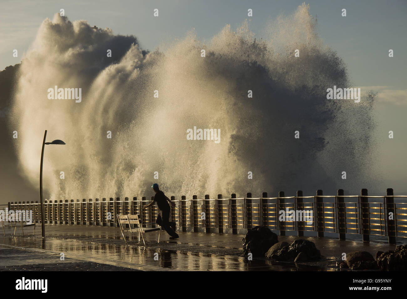 Man running from wave hi-res stock photography and images - Alamy