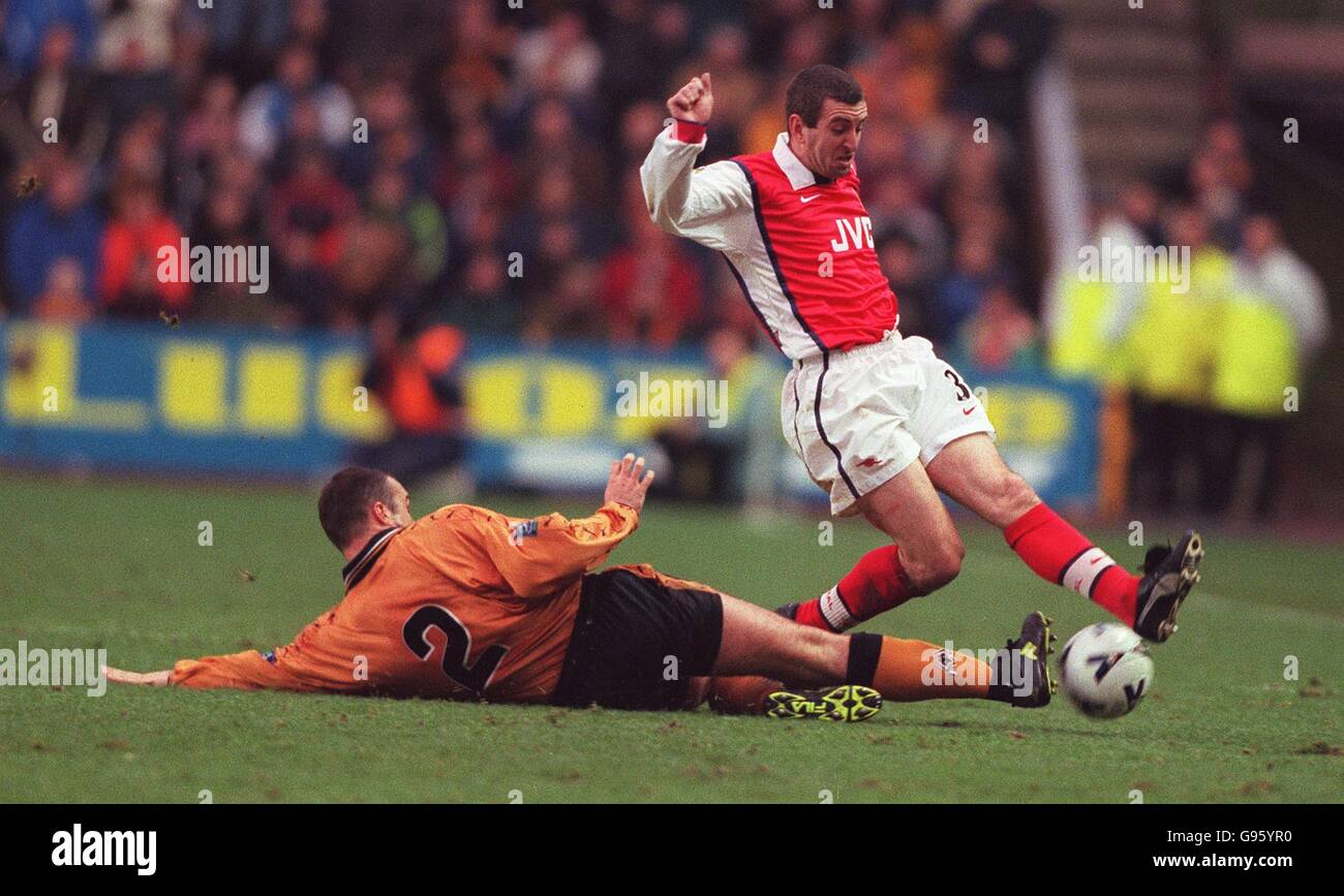 Wolverhampton Wanderers' Mark Atkins tackles Arsenal's Nigel Winterburn ...