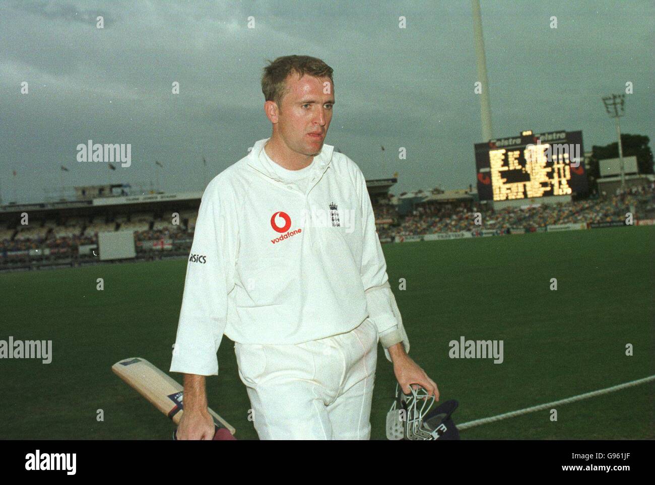 England's Dominic Cork leaves the Gabba after bad light stopped play in ...