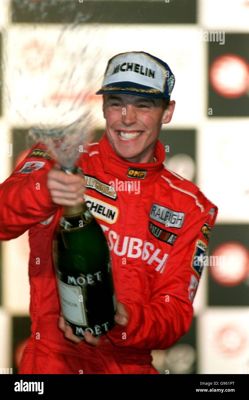 England's Richard Burns sprays champagne to celebrate winning the Rally ...