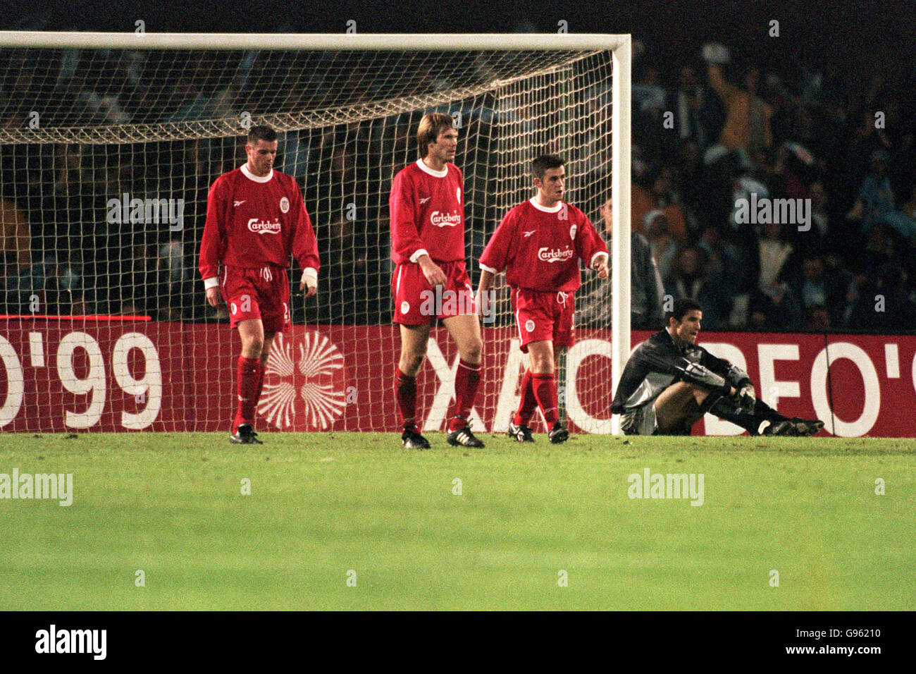 The Liverpool defence stand dejected as Celta Vigo go and celebrate ...