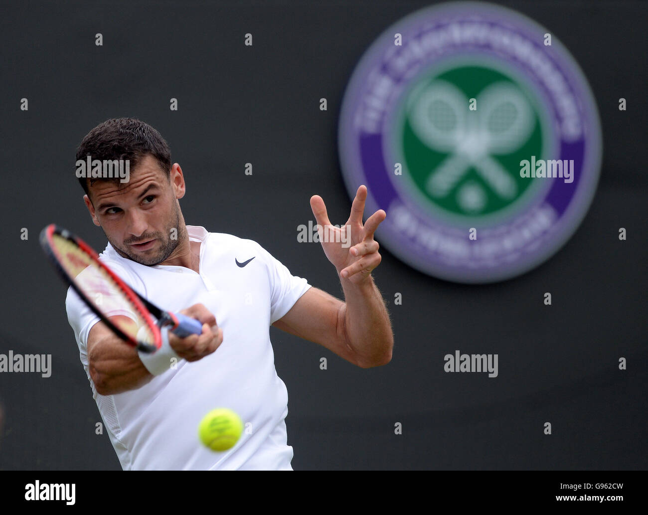 Grigor Dimitrov in action against Gilles Simon on day Four of the Wimbledon Championships at the ...