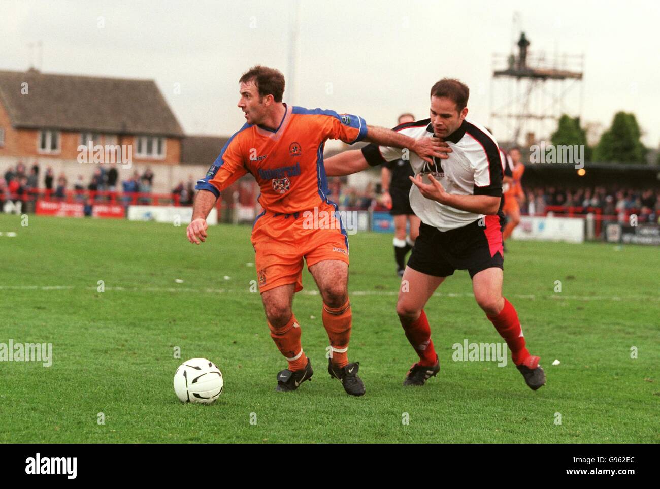 Luton Town's Phil Gray (left) shields the ball from Borehamwood's Alan ...