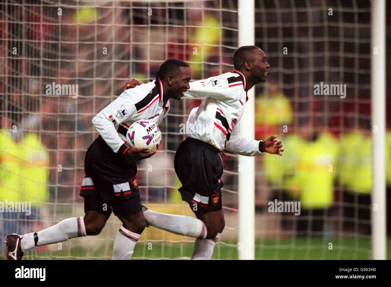 Dwight Yorke (left) and Andy Cole (right) celebrate another goal for ...