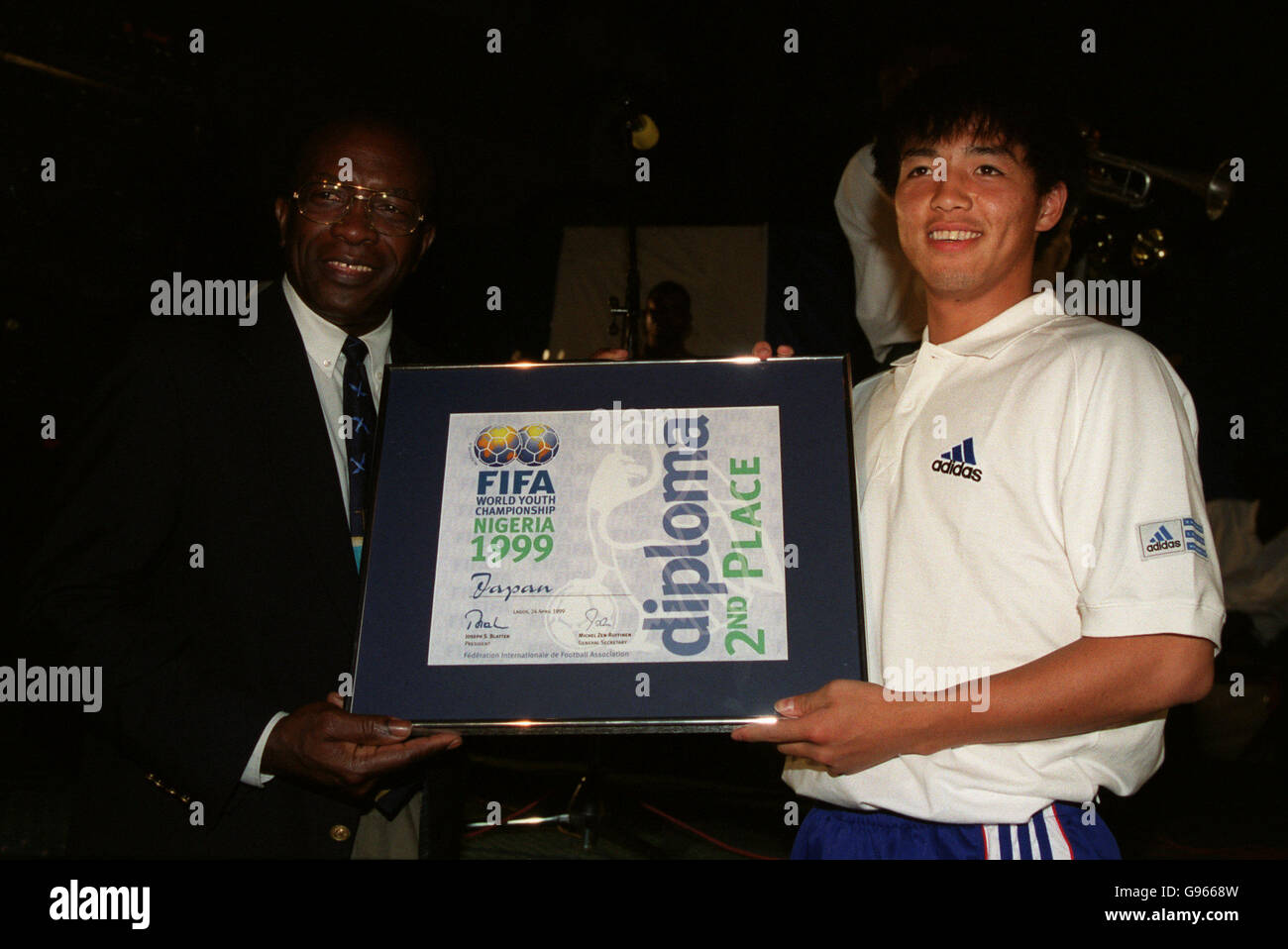 Japan's Captain Shinji Ono accepts the official FIFA certificate for ...