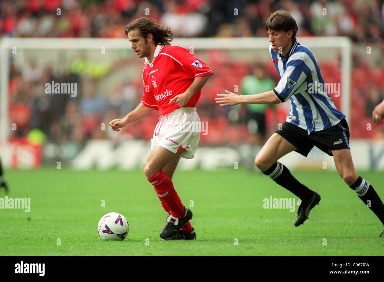 L-R; Nottingham Forest's goalscorer Hugo Porfirio escapes the challenge ...