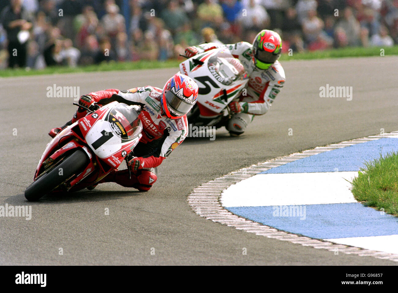 World Superbikes - Donington Park. Carl Fogarty (1) leads Colin Edwards ...