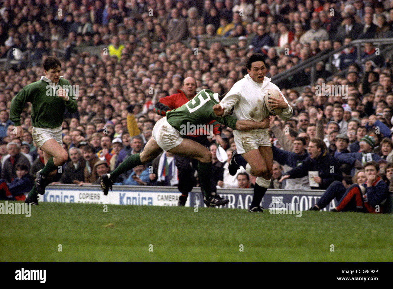 JIM STAPLES (IRELAND) TACKLES RORY UNDERWOOD (ENGLAND) AS HE CHARGES ...