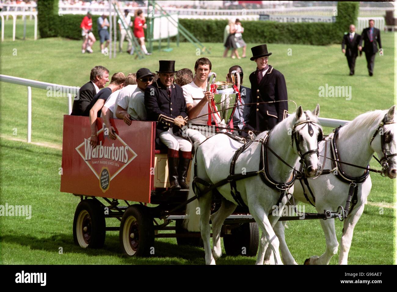 Manchester United players parade the European Cup around Haydock Park ...