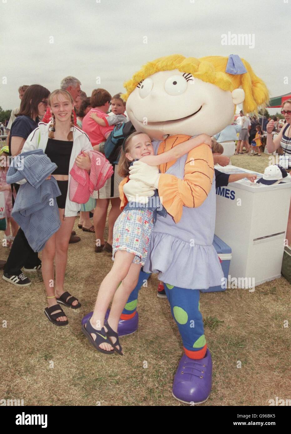 Young spectator hugs character from the rugrats childrens tv programme ...