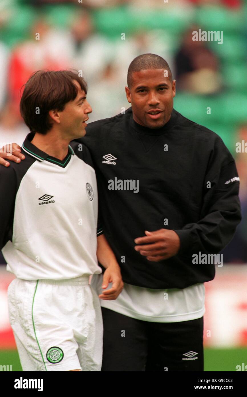 Celtic head coach John Barnes (right) chats to new signing Eyal ...