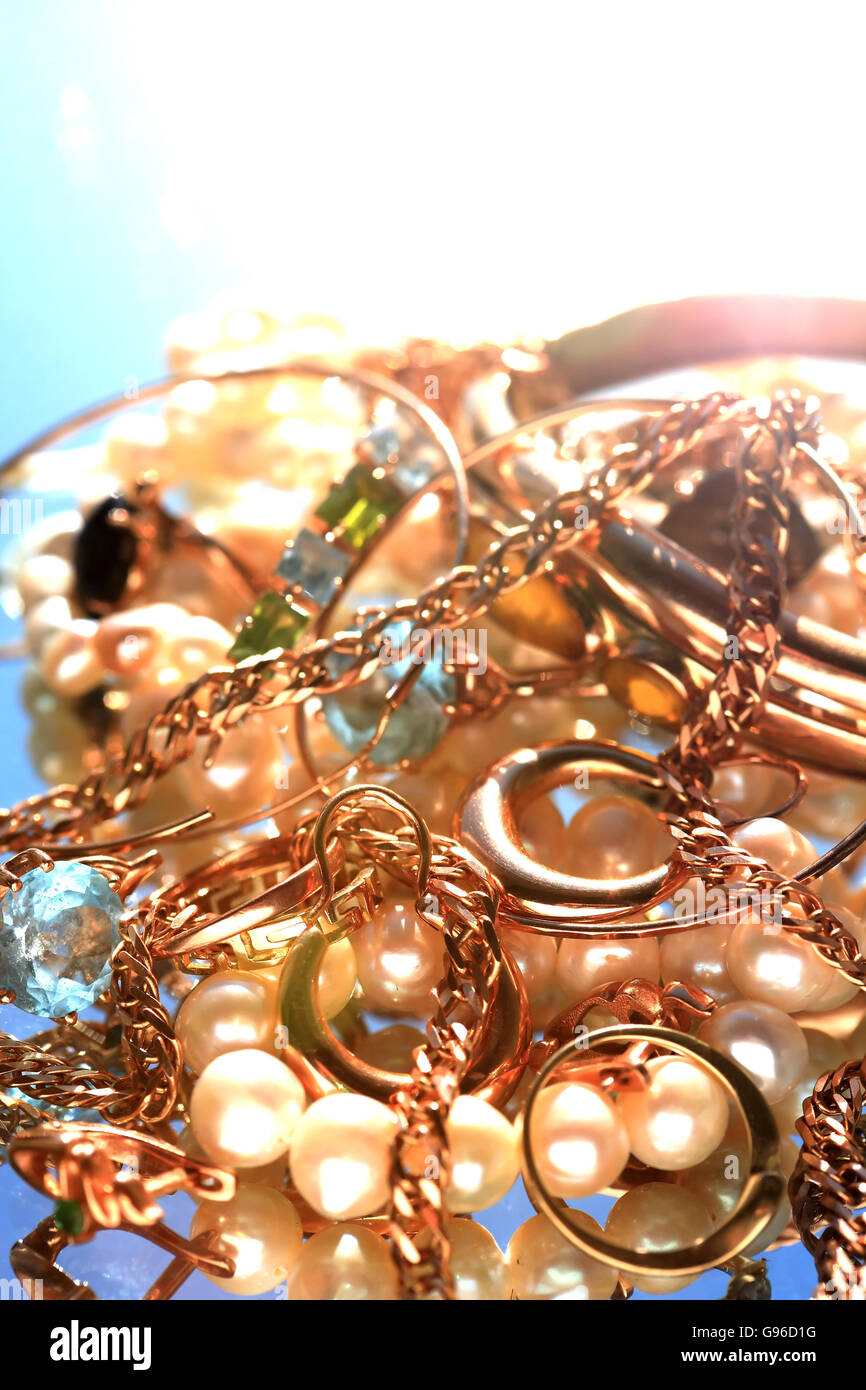 Set of various jewelry on glass background under sunlight Stock Photo ...
