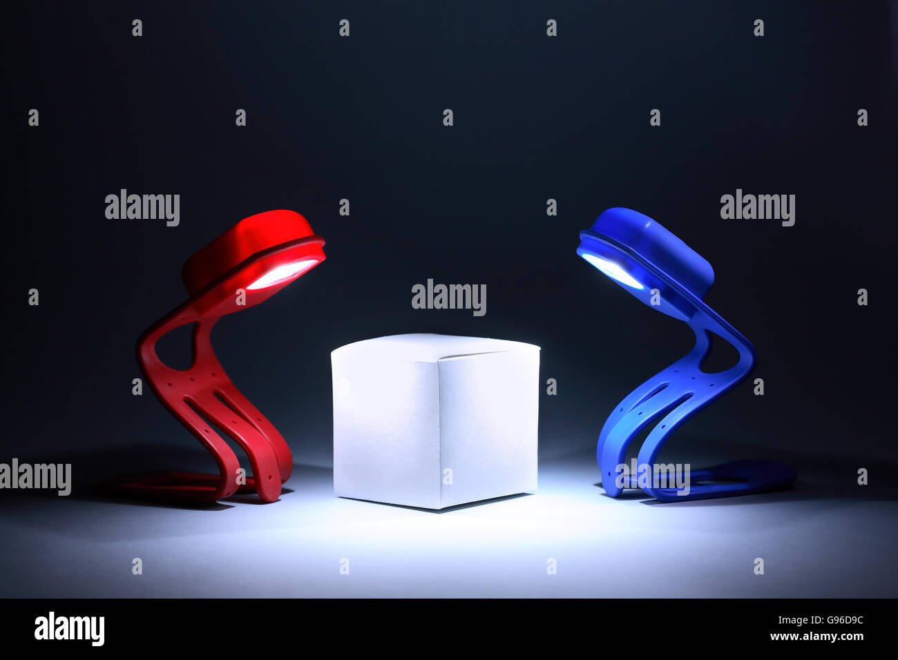 Closed white box between pair of glowing lamps on dark background Stock ...