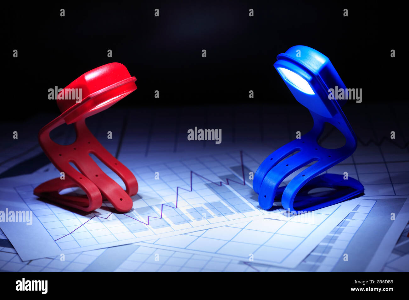 Strategy and planning. Two glowing electric lamps on paper with chart ...