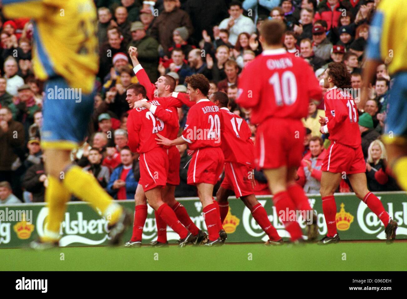 Dominic Matteo, Liverpool (arm raised) celebrates scoring with his ...