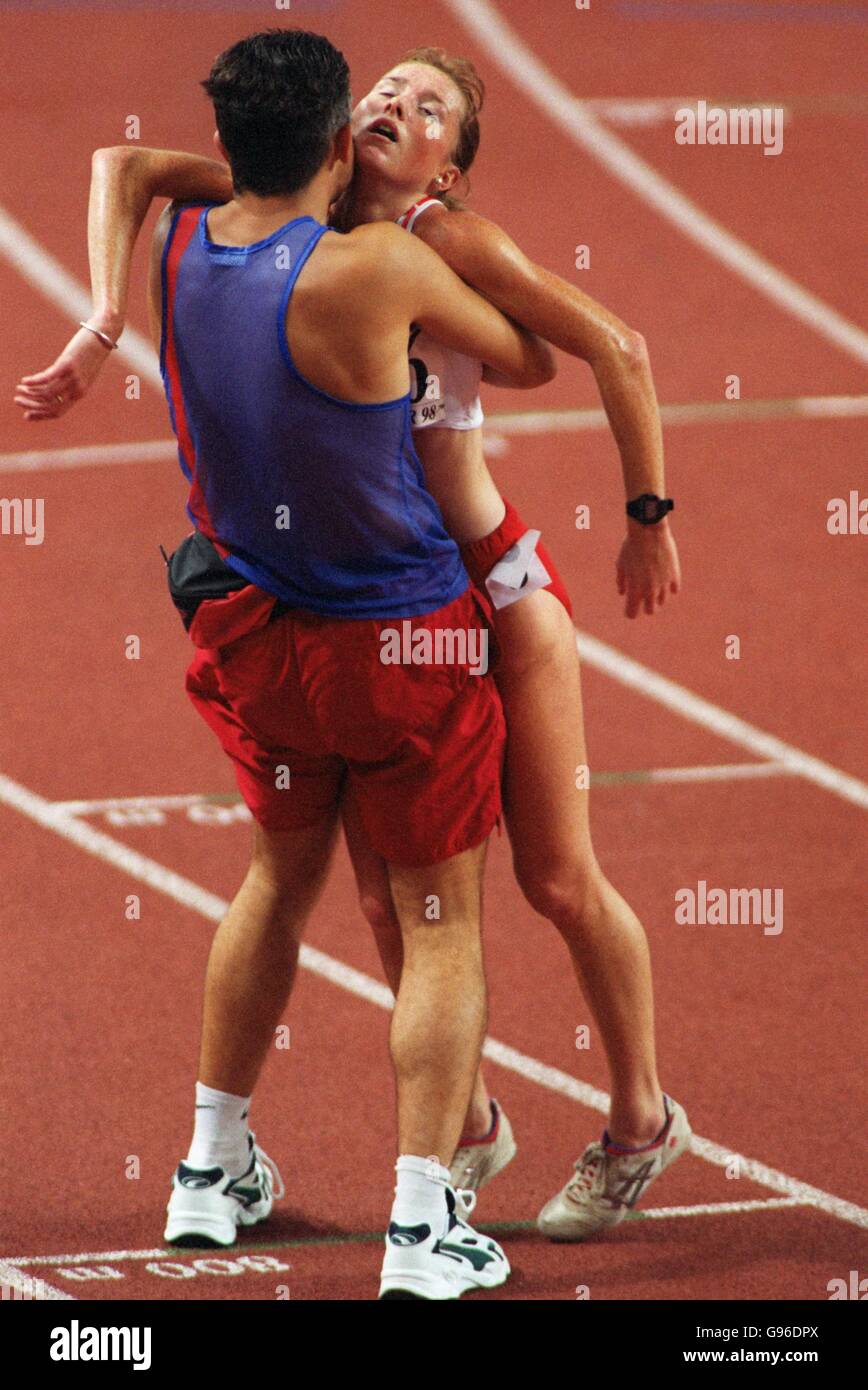 England's Andrea Whitcombe collapses with exhaustion after winning the ...