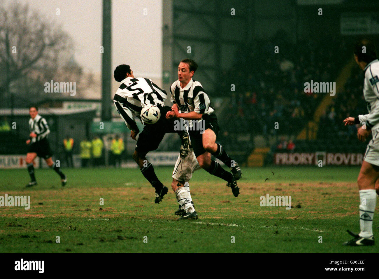 L-R; Notts County's Richard Liburd collides with teammate Shaun Murray ...