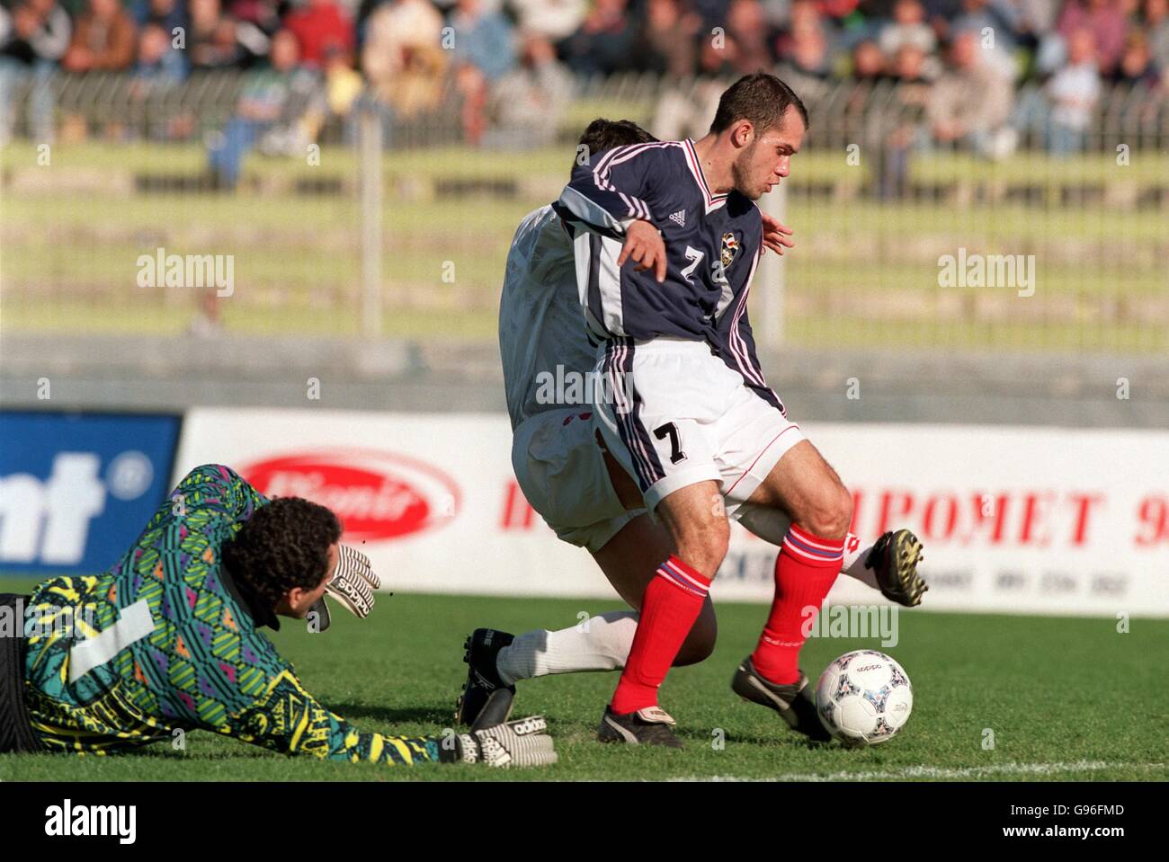 Yugoslavia's Albert Nadj (right) goes past Malta's Brian Said (centre ...