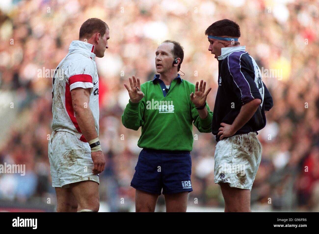 Referee David McHugh (centre) talks to England's Lawrence Dallaglio ...
