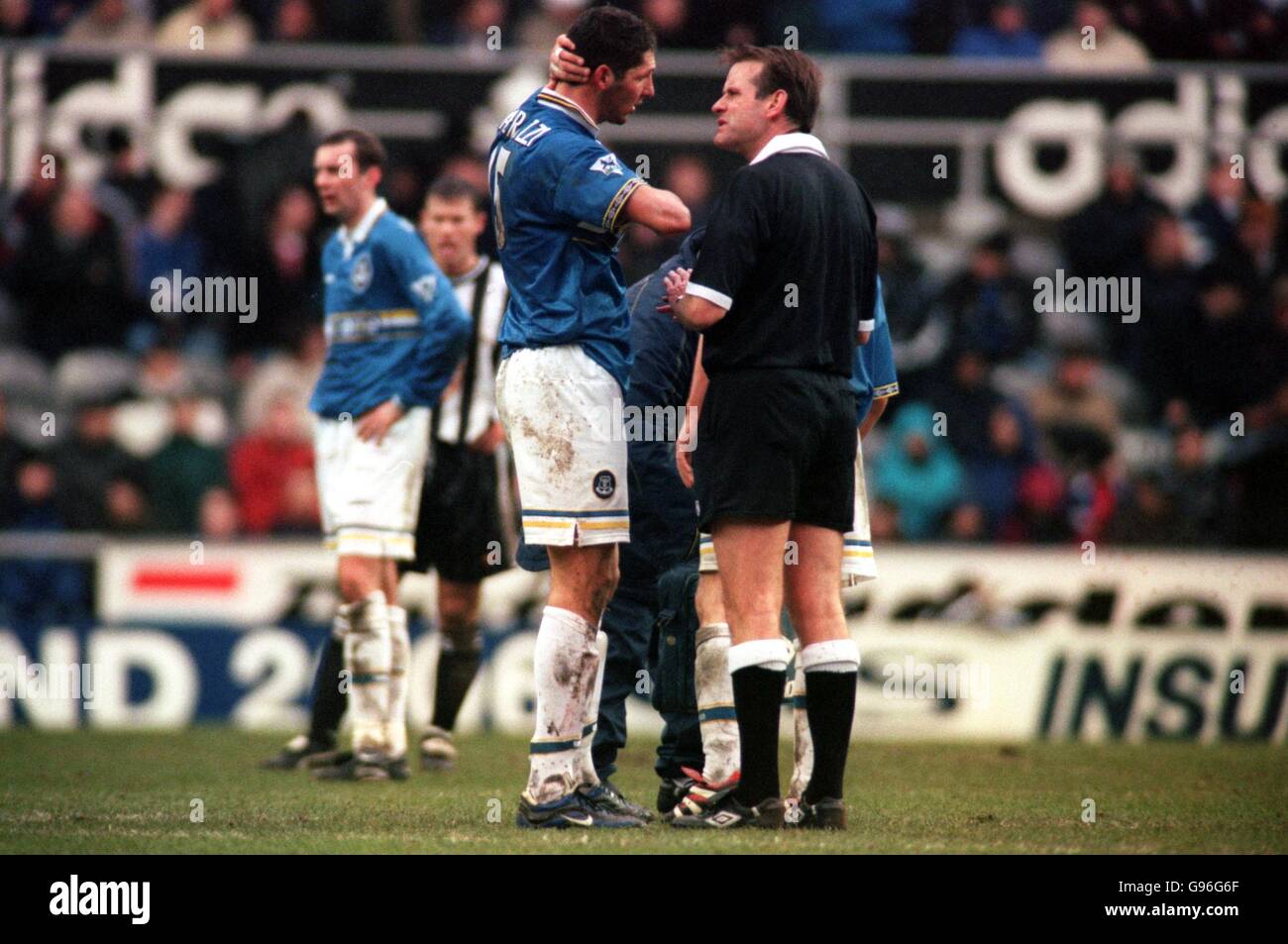 Everton's Marco Materazzi complains to referee Graham Barber that he ...