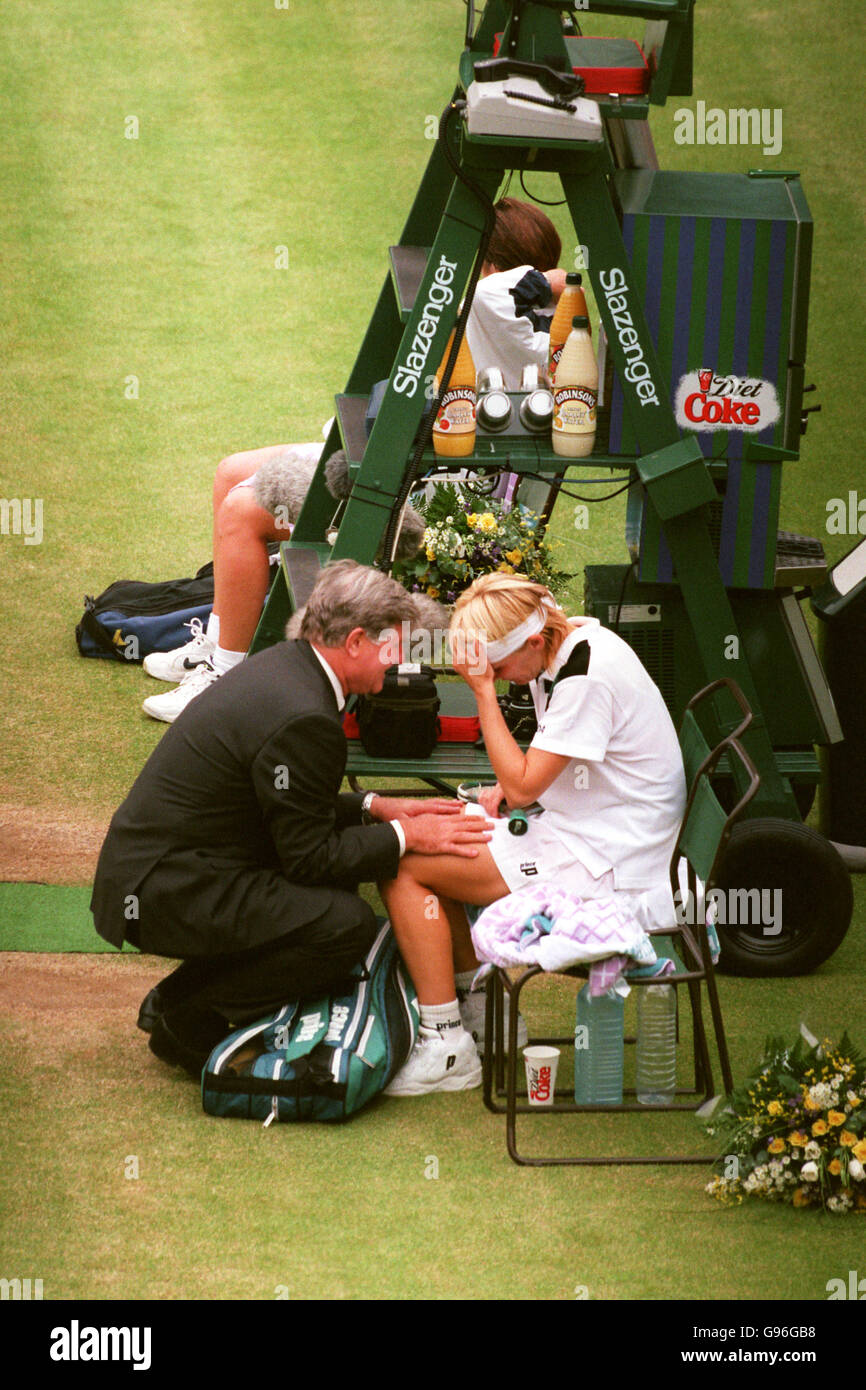 Tournament referee Alan Mills (left) has a quiet word with champion ...