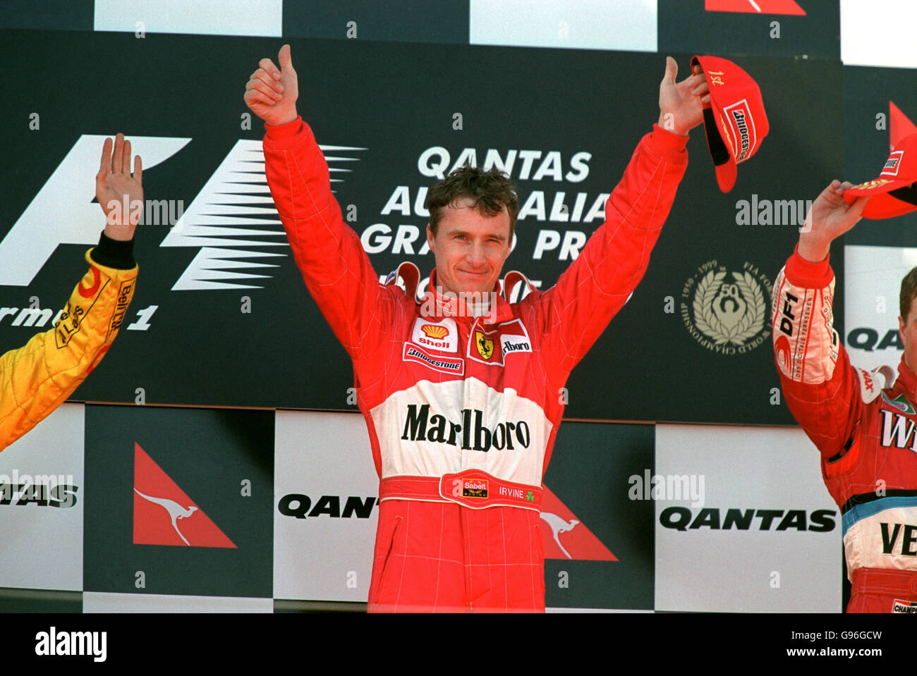 Eddie Irvine, Ferrari, winks at the crowd after winning his first Grand ...