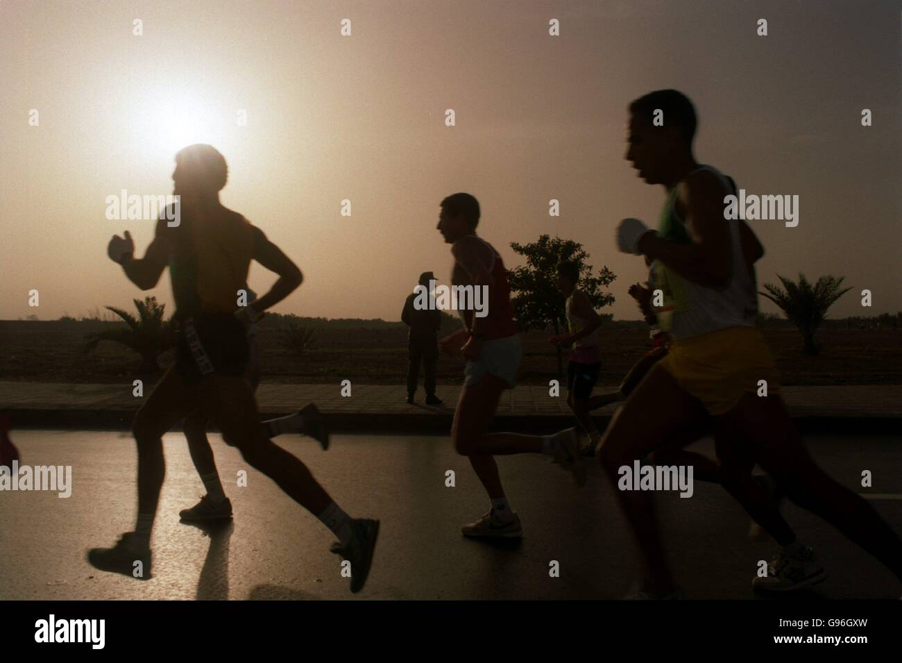 MARATHON. RUNNING IN THE MIDDAY SUN IN THE MARRAKESH MARATHON, MOROCCO ...