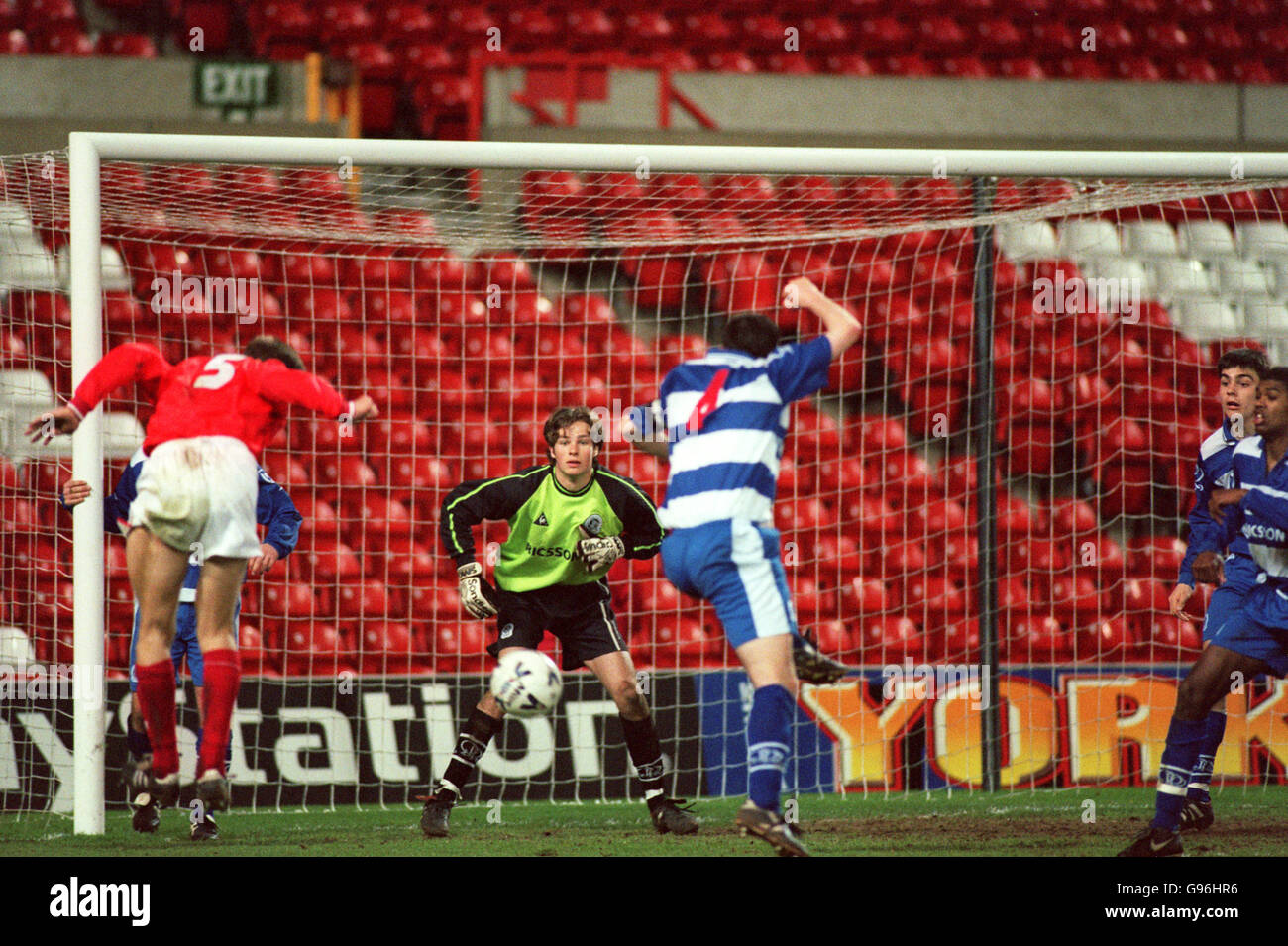 Nottingham Forest's Kevin Dawson (left) heads for goal, watched by ...
